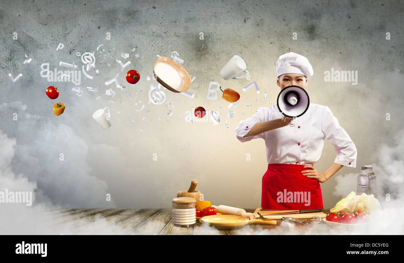 Asian female cook holding megaphone Stock Photo - Alamy