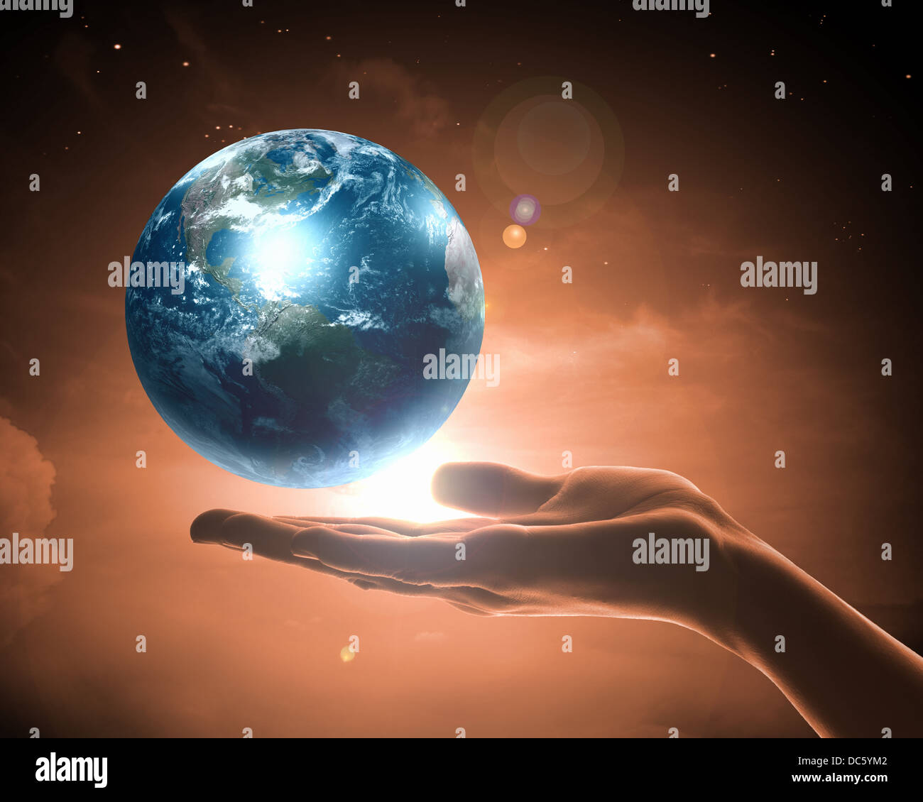 Image of earth planet on hand Stock Photo - Alamy