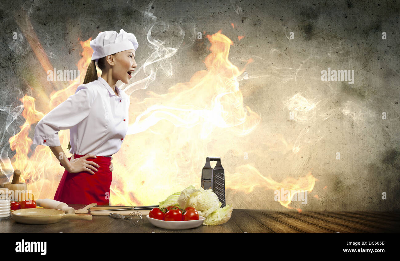 Asian female cook in anger Stock Photo - Alamy