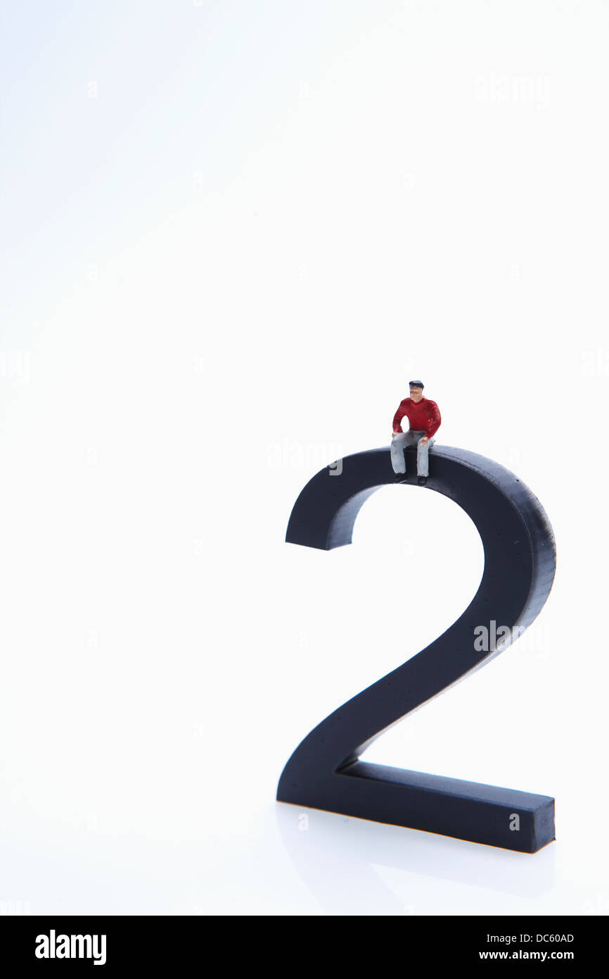 a man sitting on number two Stock Photo - Alamy