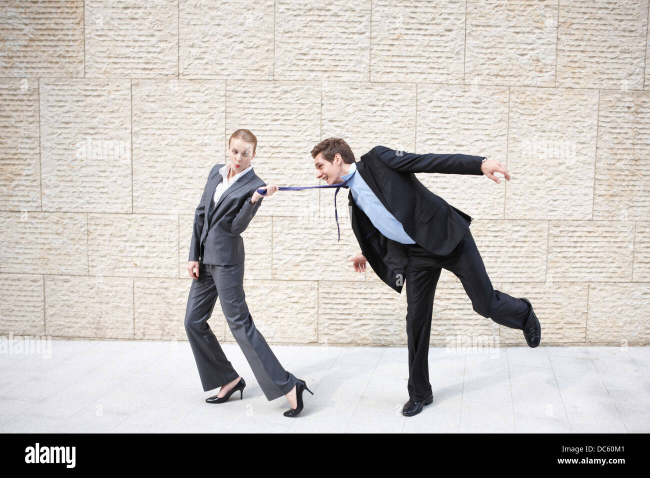 Business man pulling tie hi-res stock photography and images - Alamy