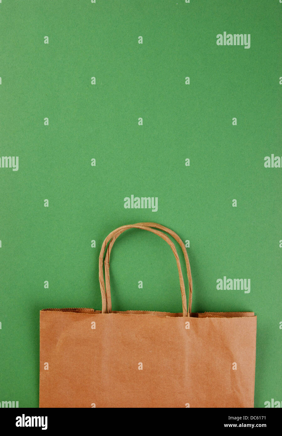 paper bag on a green background Stock Photo - Alamy