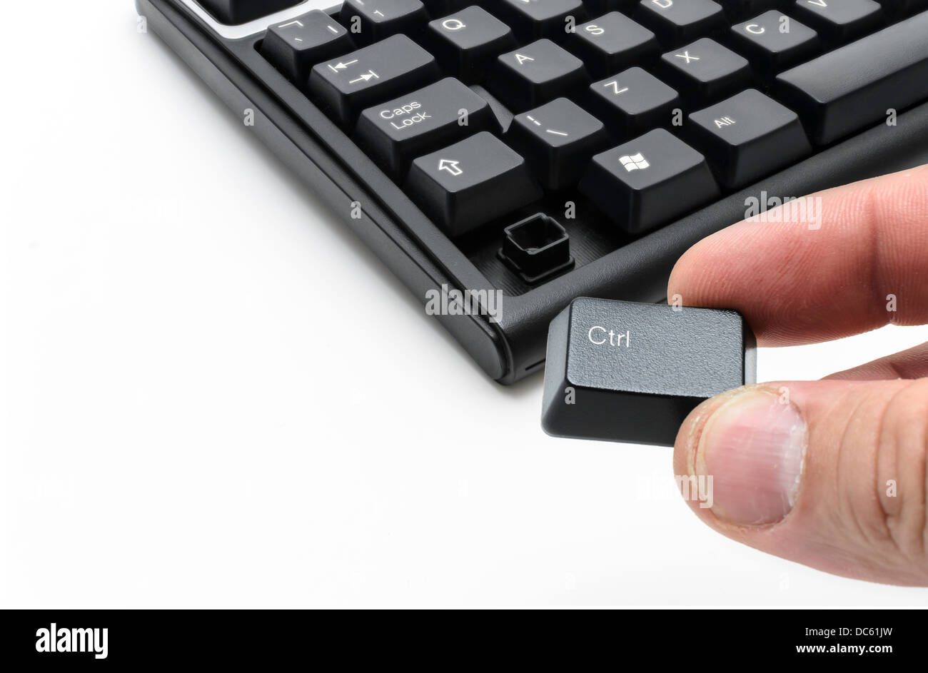 Hand taking control key from keyboard on white background Stock Photo ...
