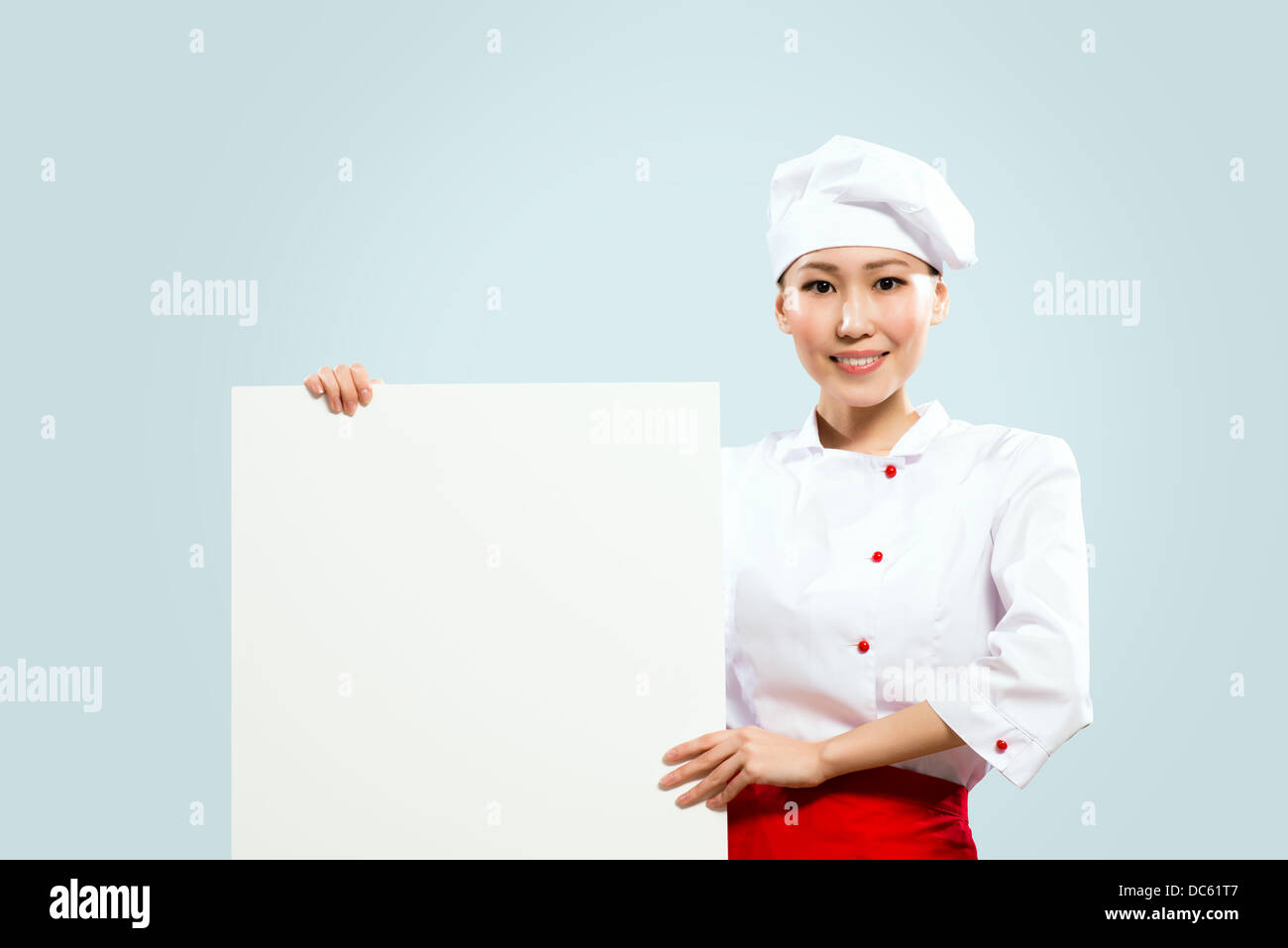 Asian female chef holding poster for the text Stock Photo - Alamy