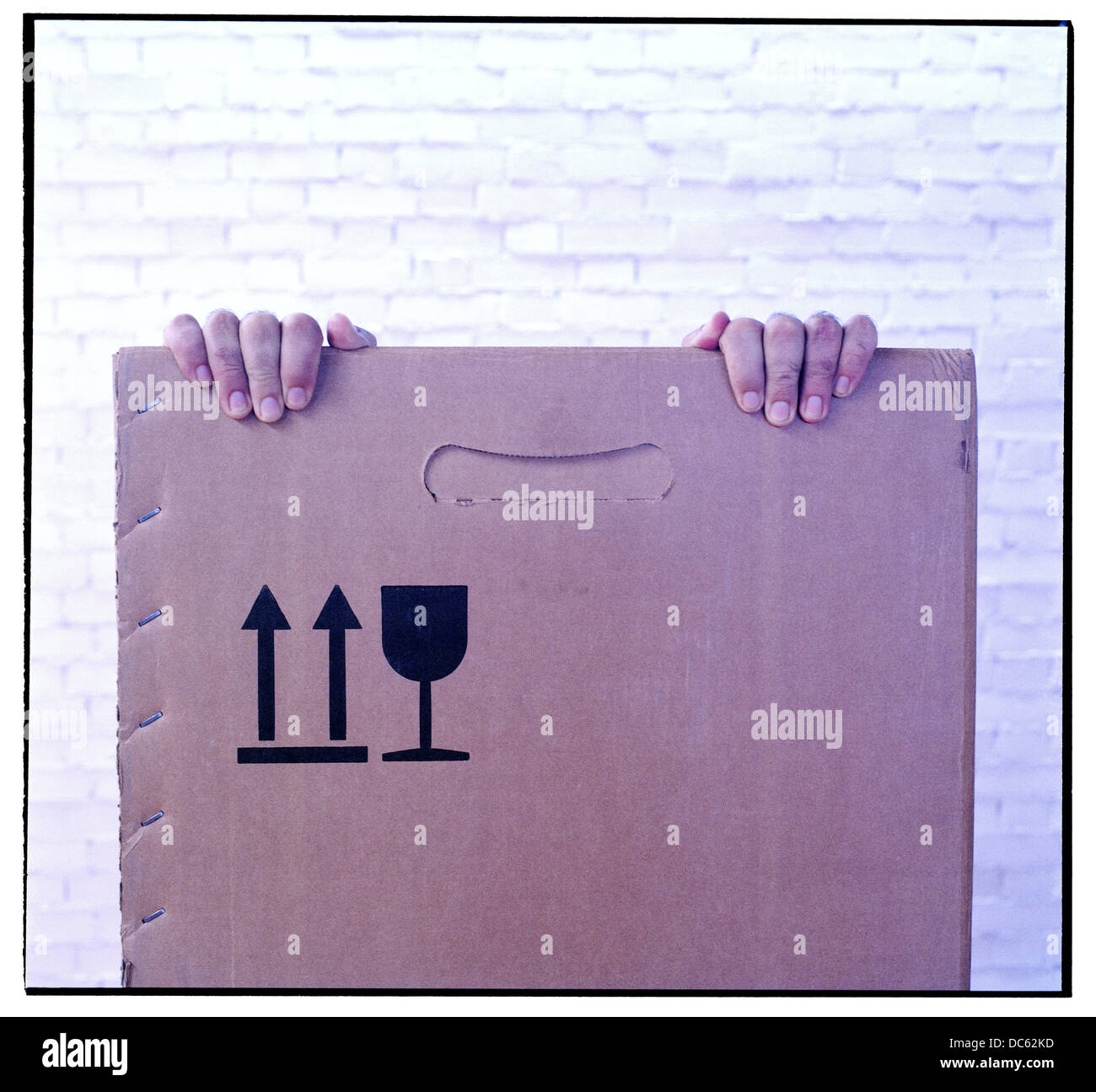 Hiding inside a cardboard box Stock Photo - Alamy