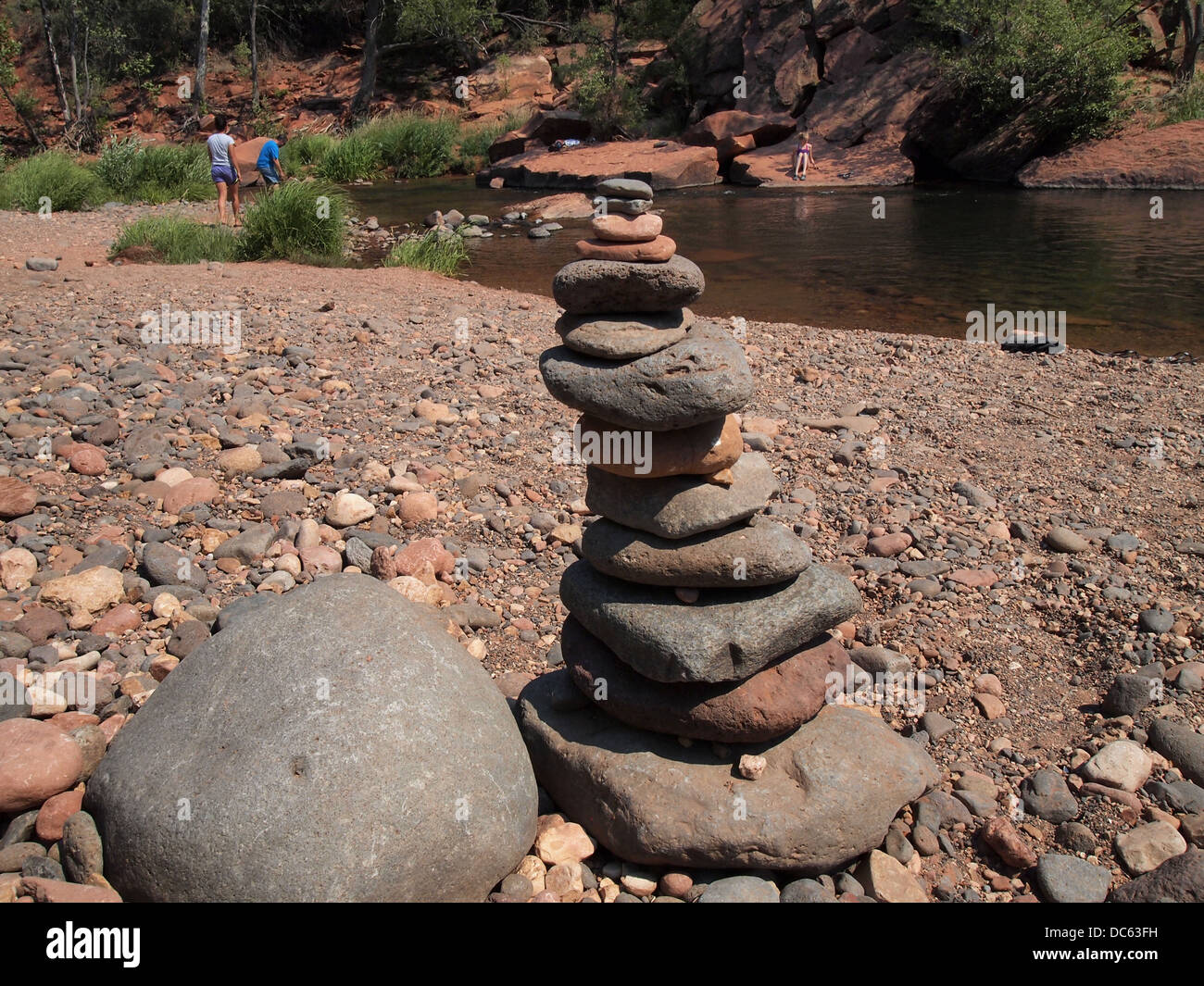 Stone stack in foreground at Buddha Beach, Oak Creek at Cathedral Rock ...