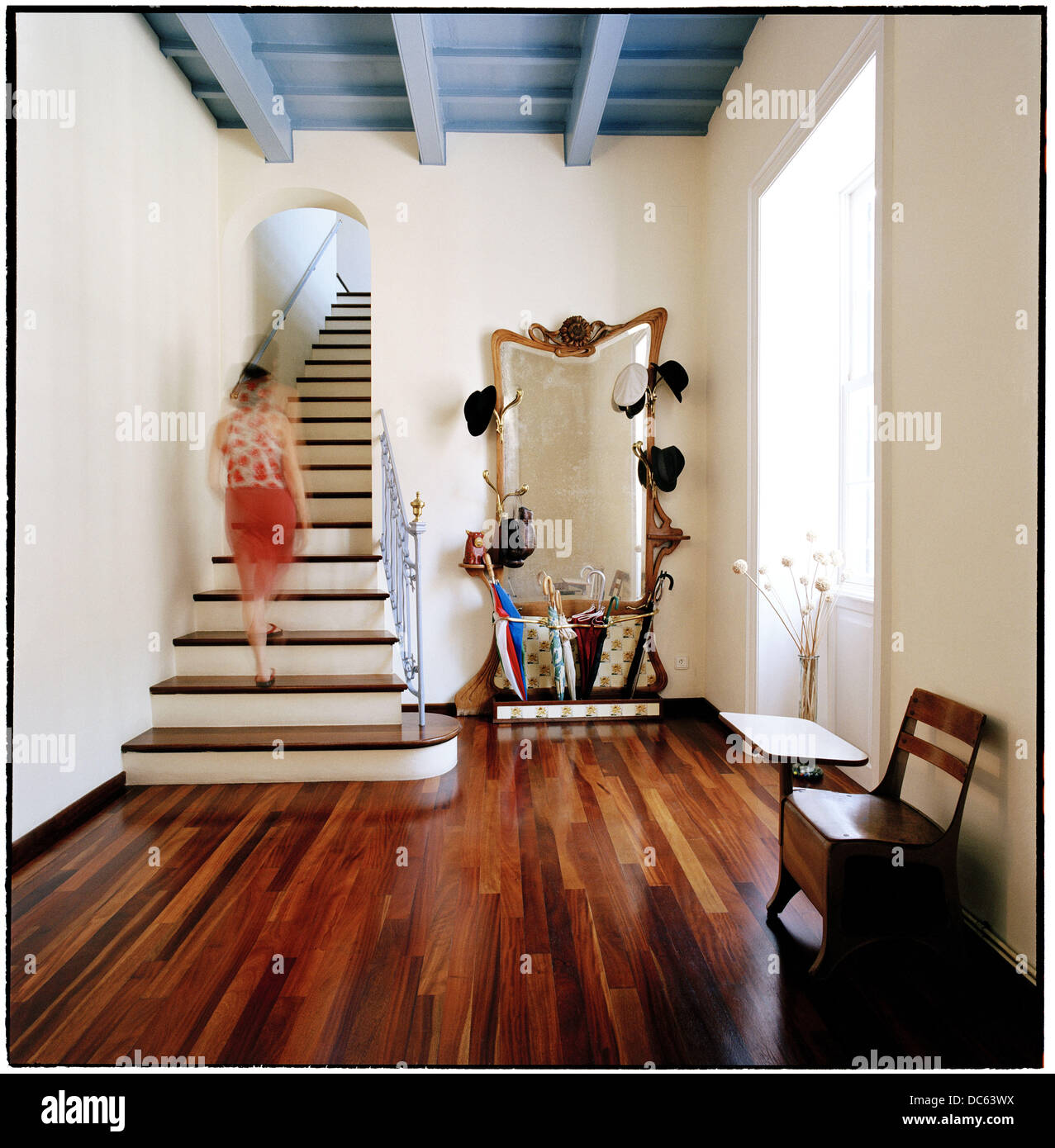 Woman climbing window rear view hi-res stock photography and images - Alamy