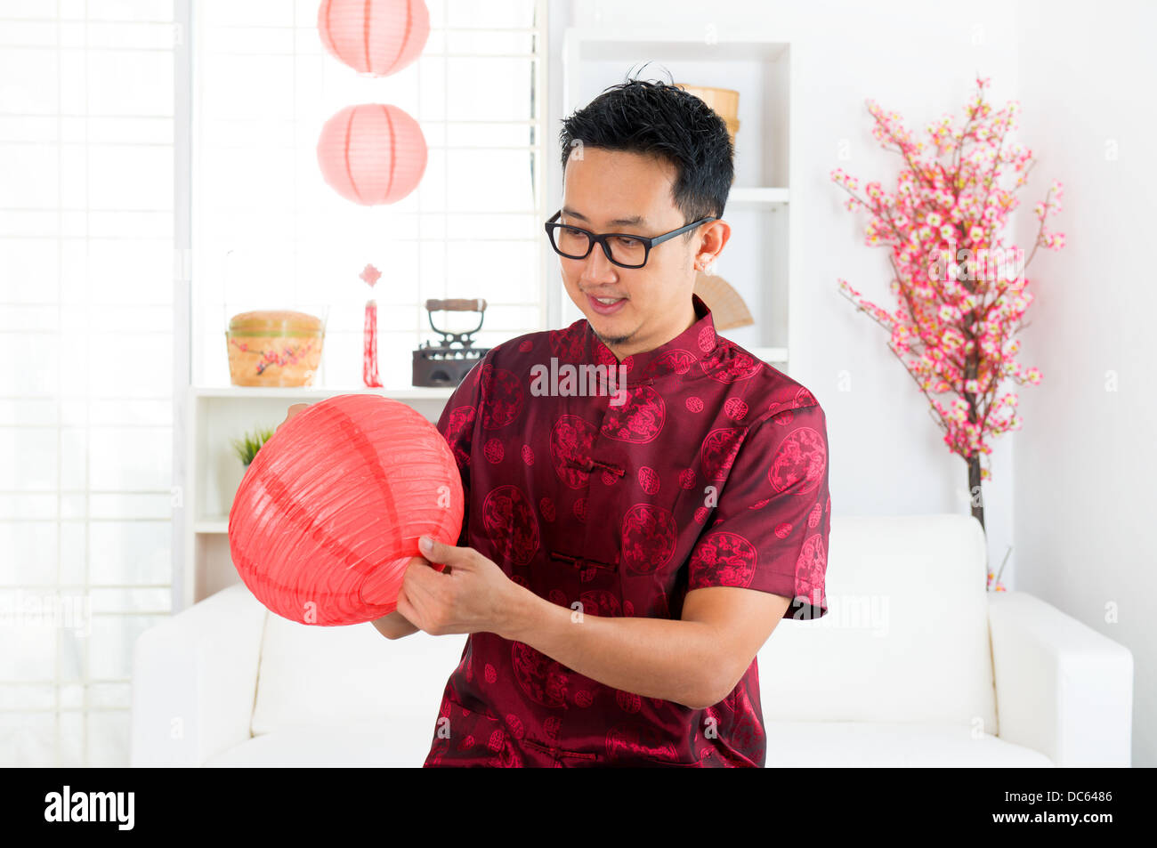 Chinese man decorating house Stock Photo - Alamy