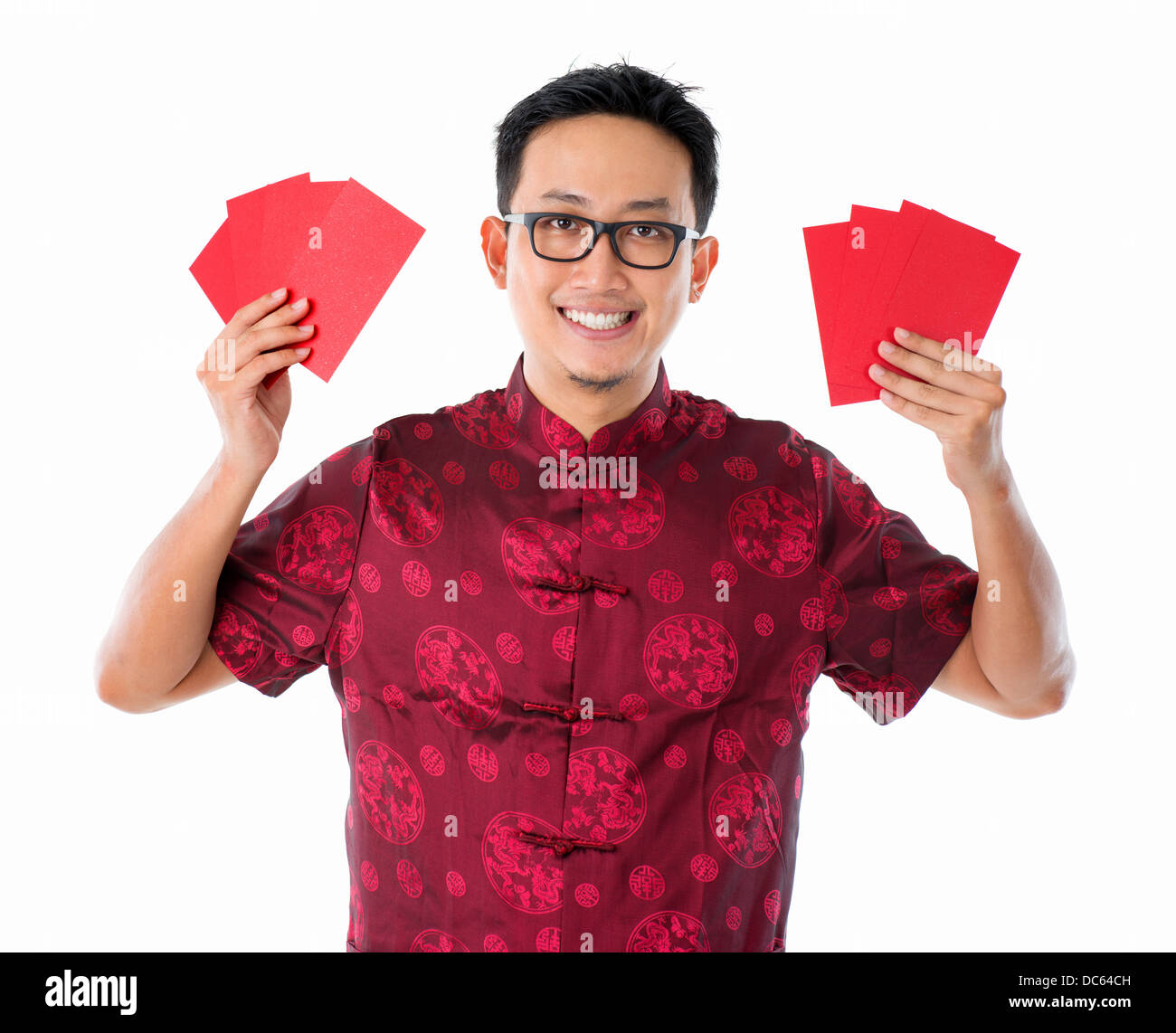 Asian Chinese man holding red packet Stock Photo - Alamy