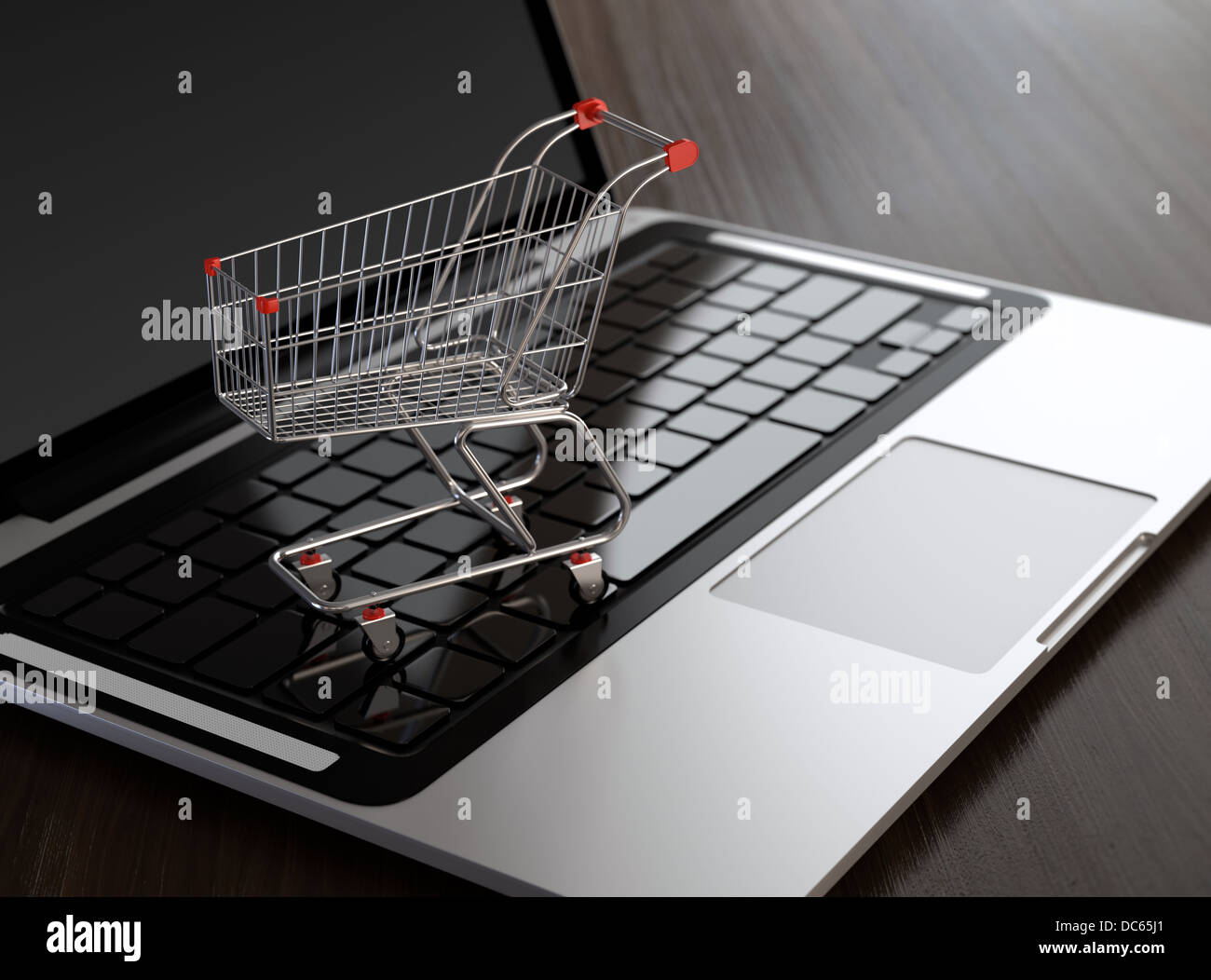 Computer generated image of shopping cart on laptop. E-commerce concept ...