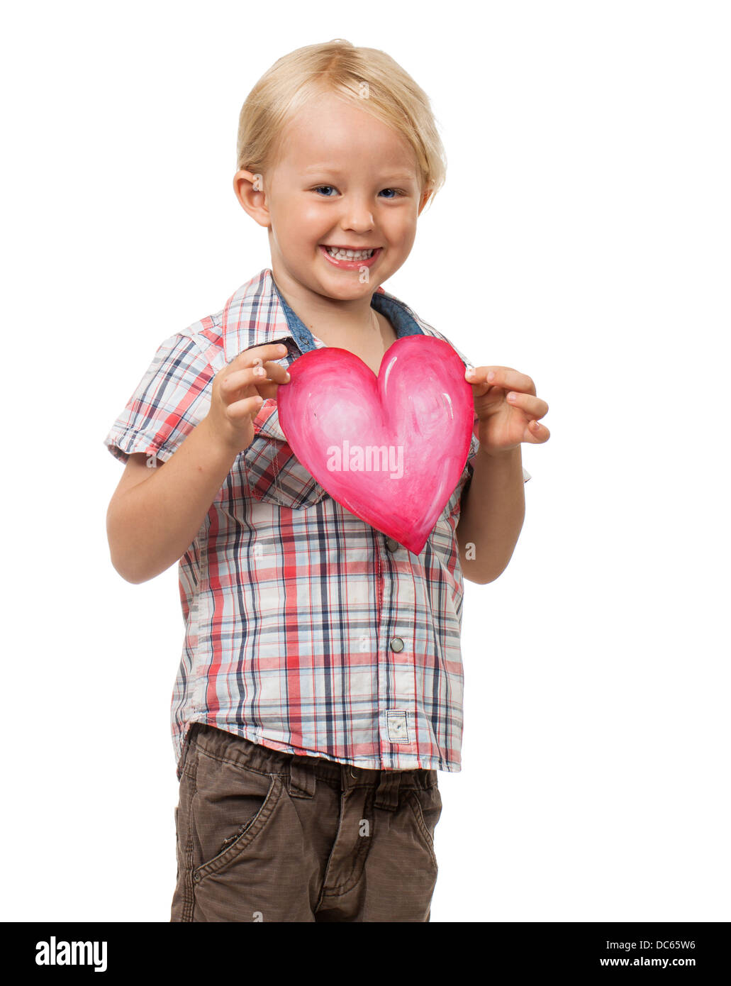 Cute young boy holding love heart Stock Photo - Alamy