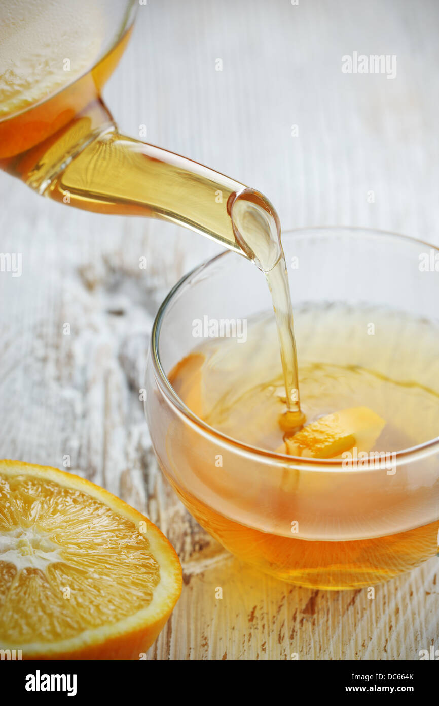 Pouring Tea into Glass Cup Stock Photo - Alamy