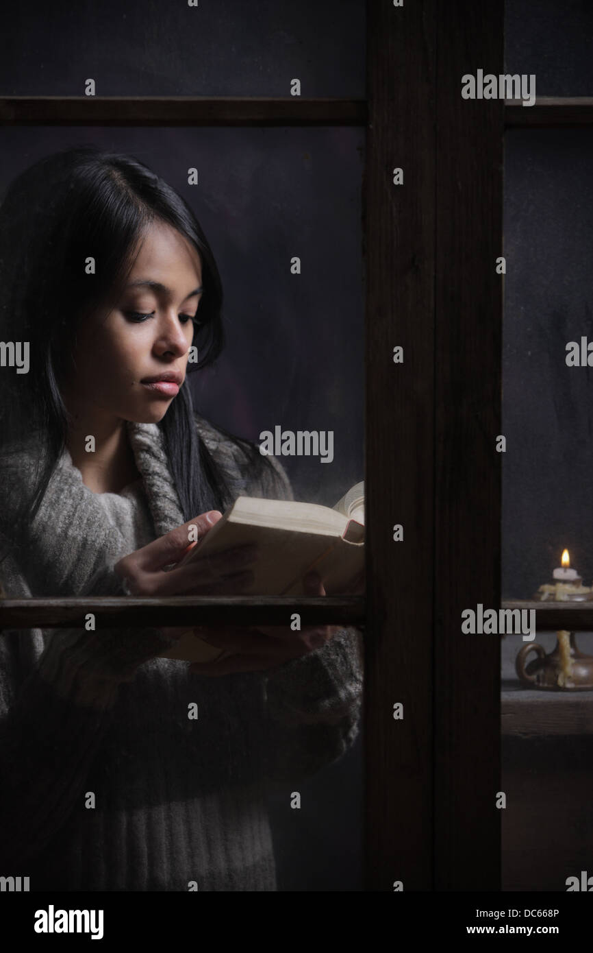 Portrait of a beautiful woman behind window Stock Photo - Alamy