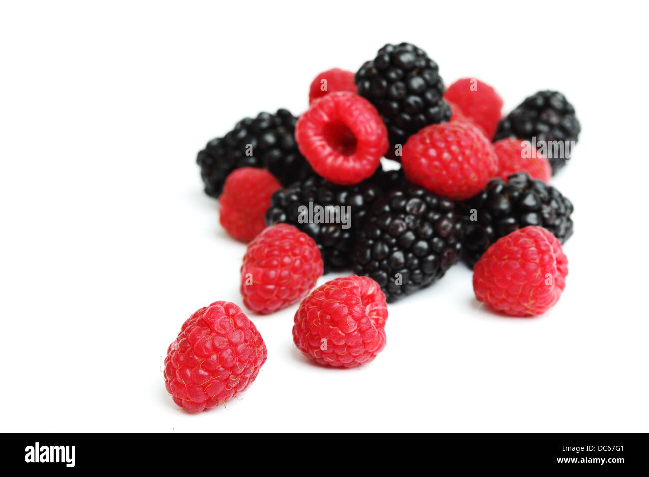 berry mixed pile on black background Stock Photo - Alamy