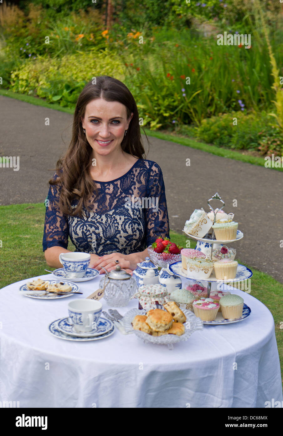 Heidi Agan, a Duchess of Cambridge lookalike, poses at a table laid out ...