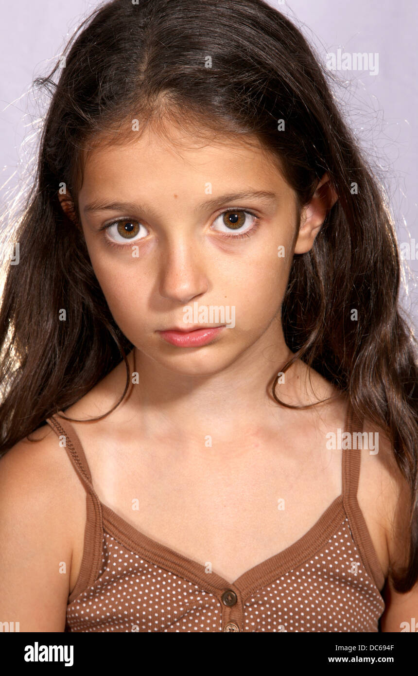 Portrait of young girl posing in studio lighting Stock Photo - Alamy