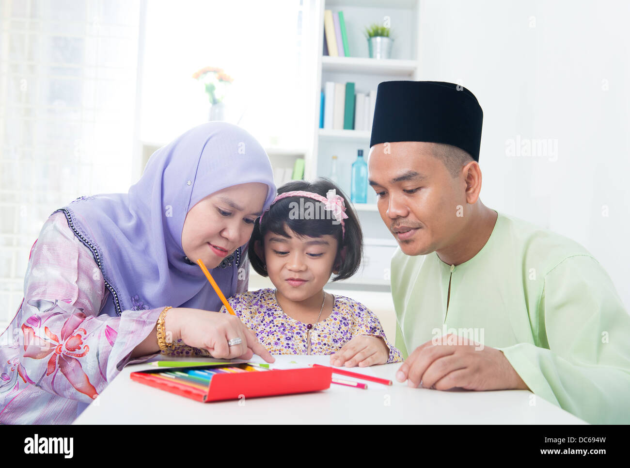 Muslim mother teaching kid hi-res stock photography and images - Alamy