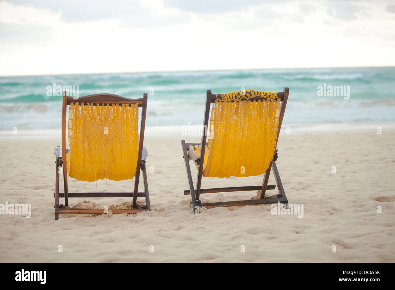 Beach yellow chairs for vacations on tropical plage in Tulum, Mexico ...