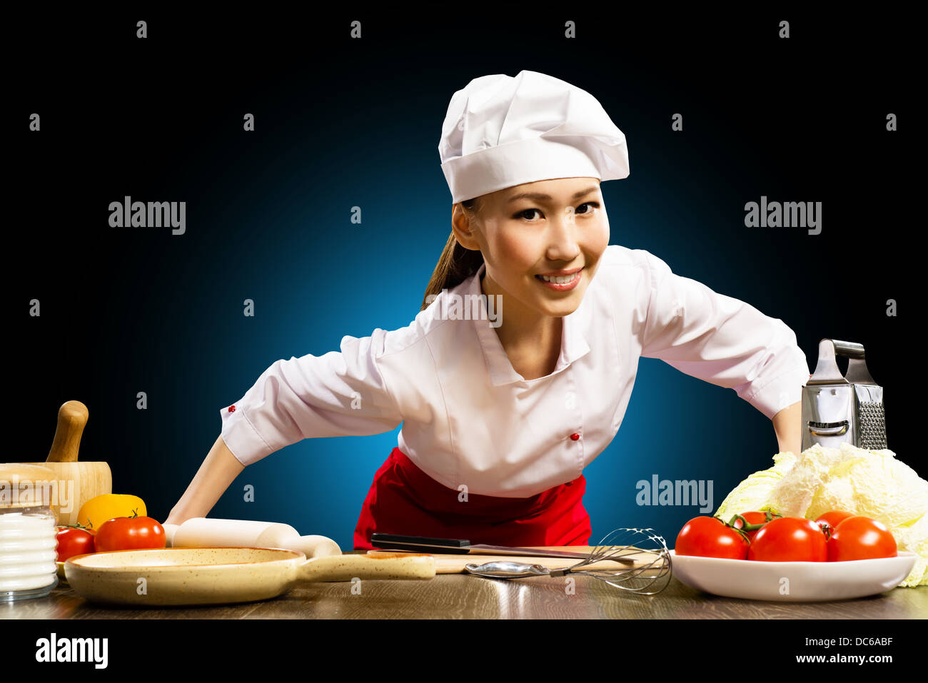 Young asian woman cooks kitchen hi-res stock photography and images - Alamy