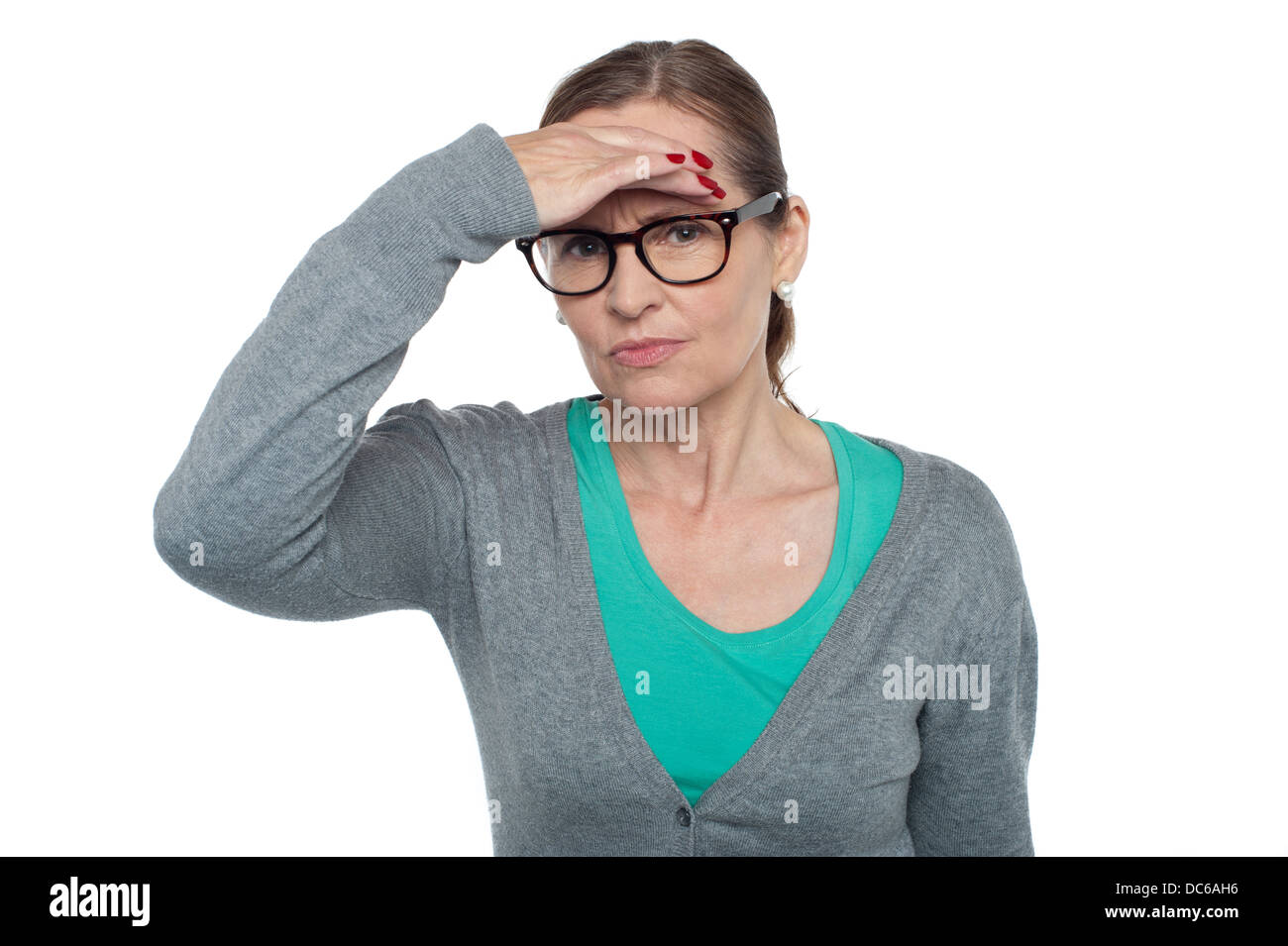 Expressionless woman looking at distance object Stock Photo - Alamy