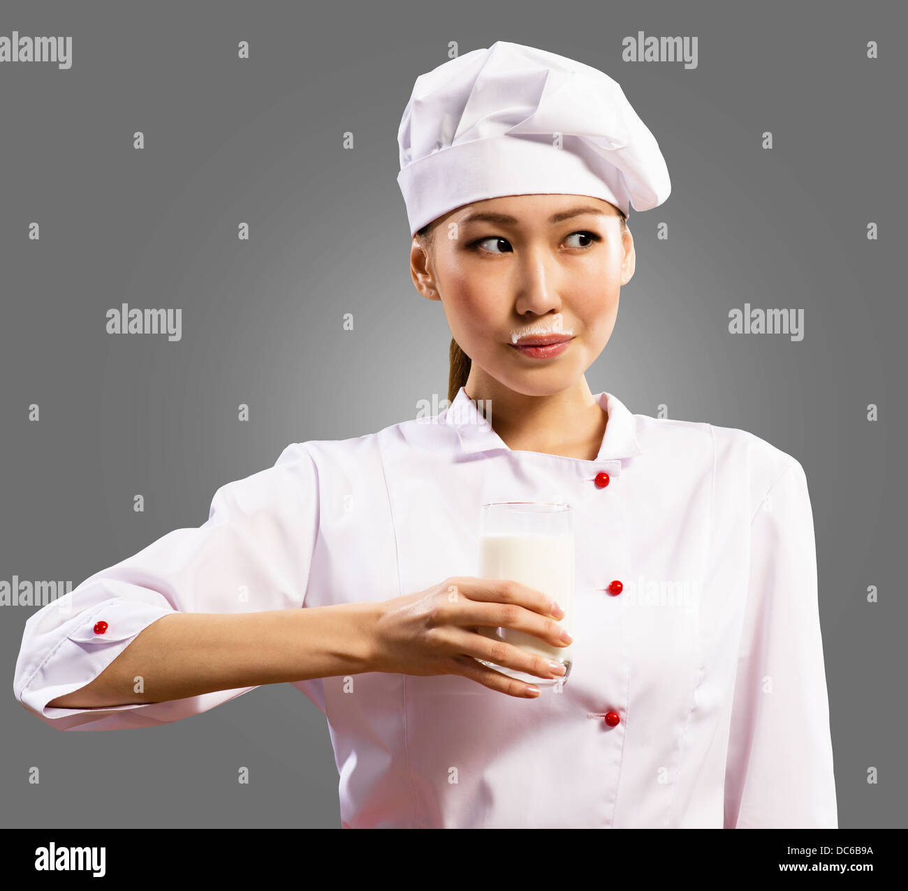 female asian chef holding a glass of milk Stock Photo - Alamy