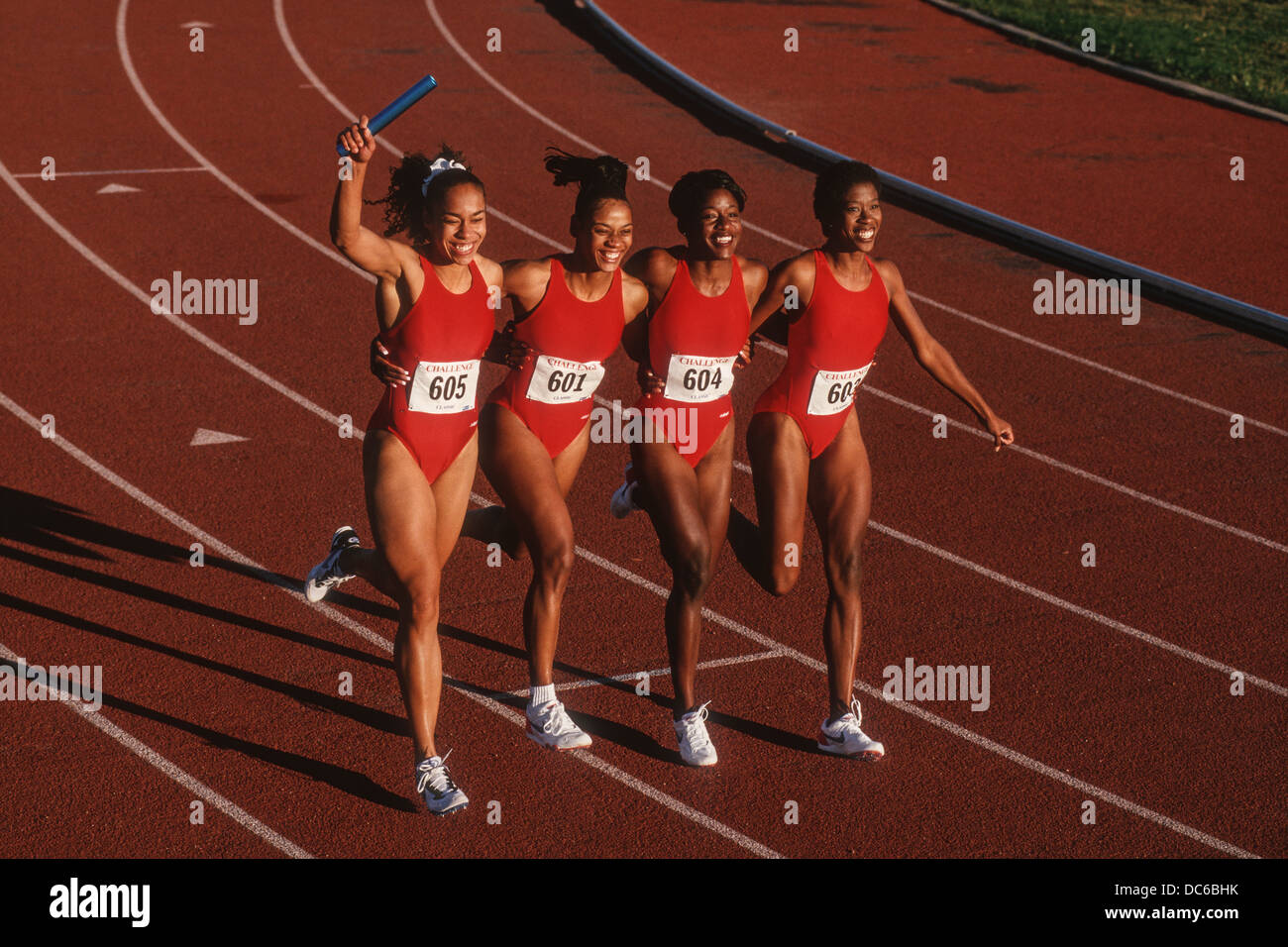 Women's track and field relay team celebrating their victory Stock ...