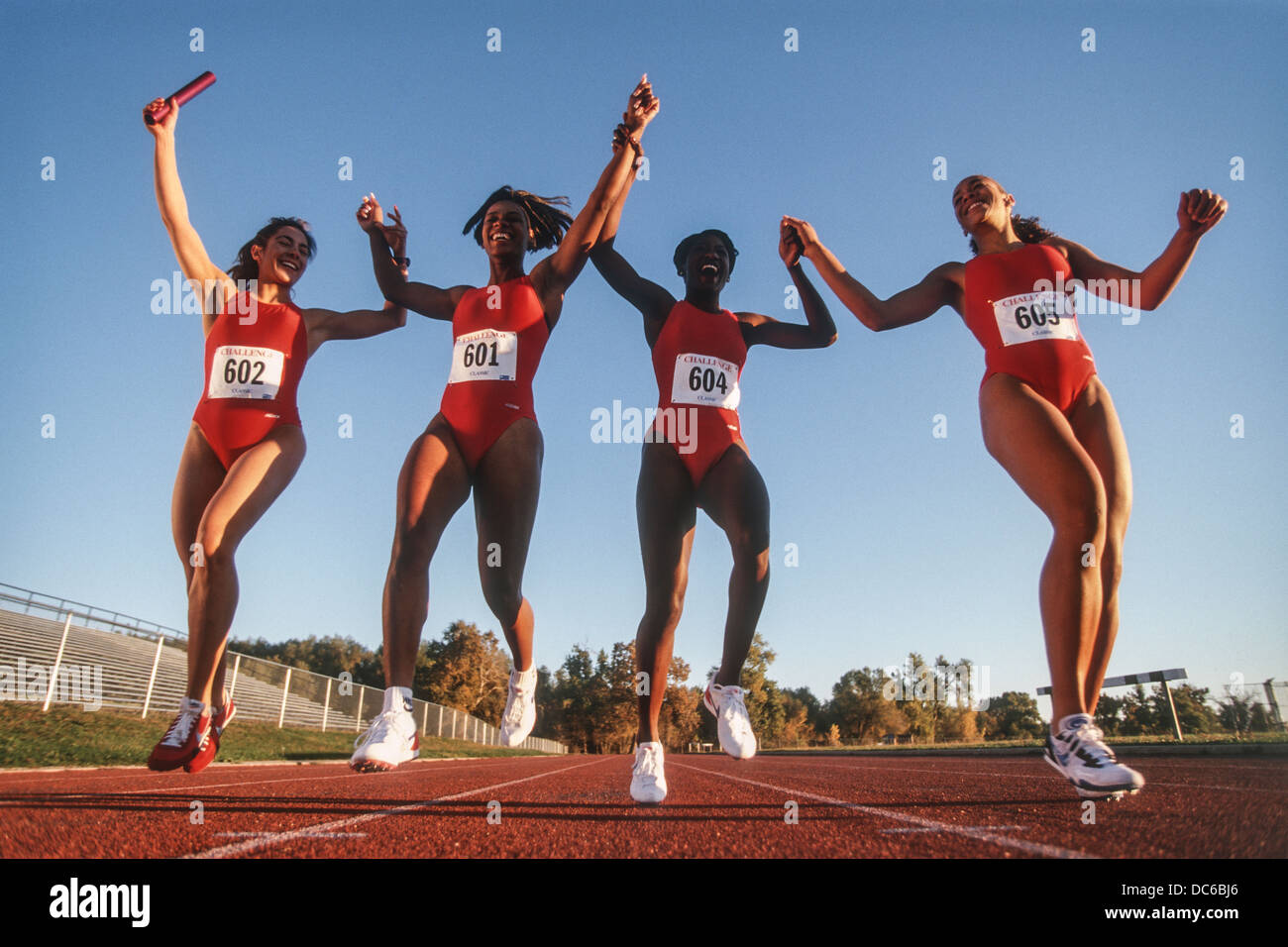 Women's track and field relay team celebrating their victory Stock ...