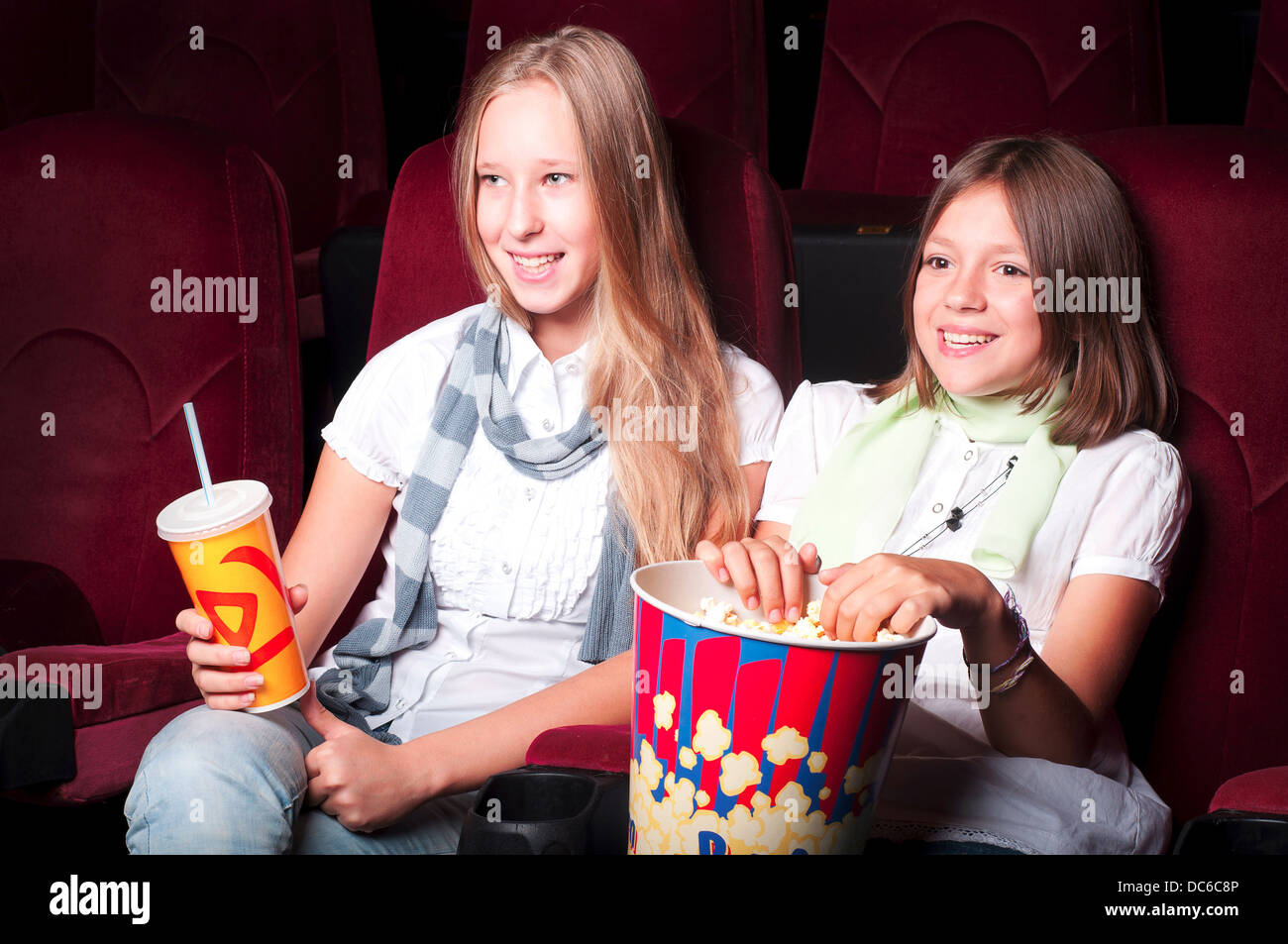 teen girls at the cinema Stock Photo - Alamy