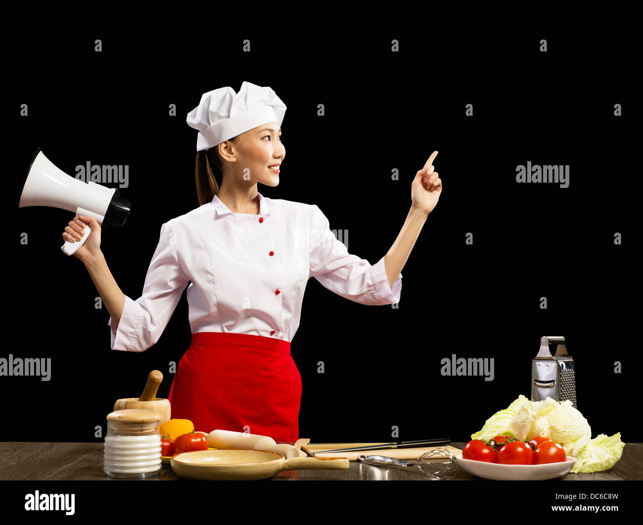 Asian female chef holding a megaphone Stock Photo - Alamy