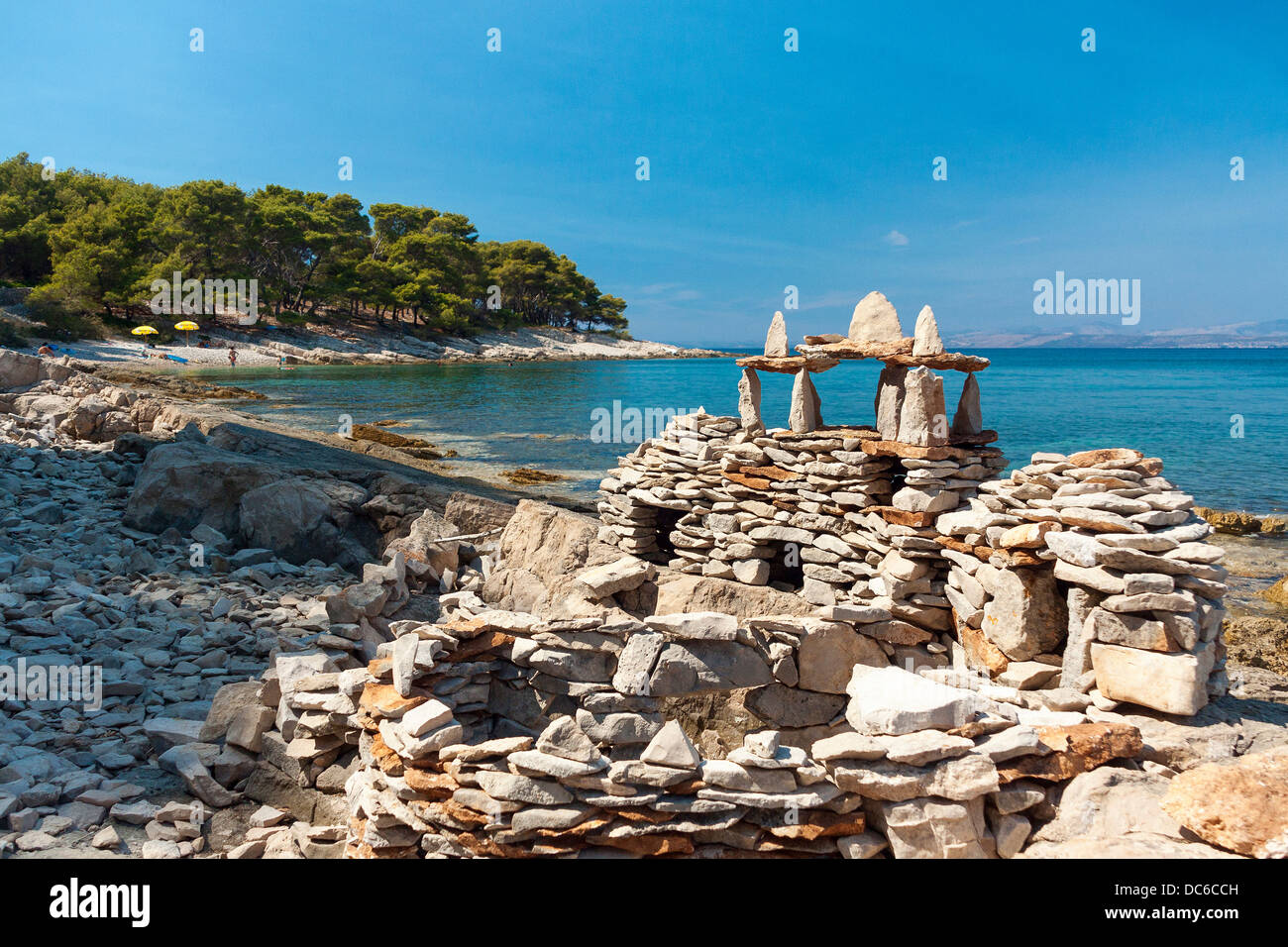 Miniature stone castle on a beach near Sutivan village on Brač island ...