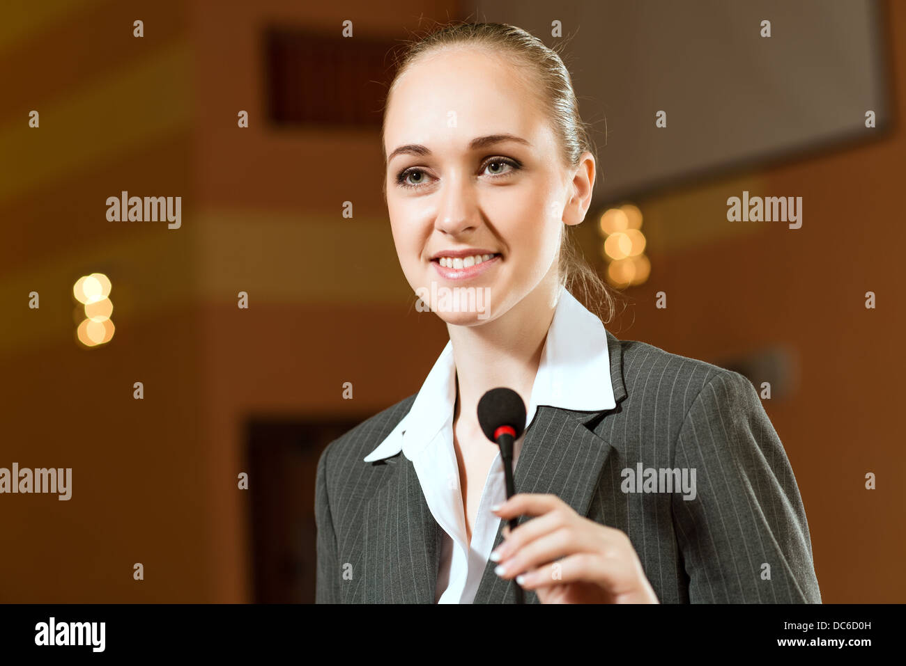 Portrait of a business woman with microphone Stock Photo - Alamy