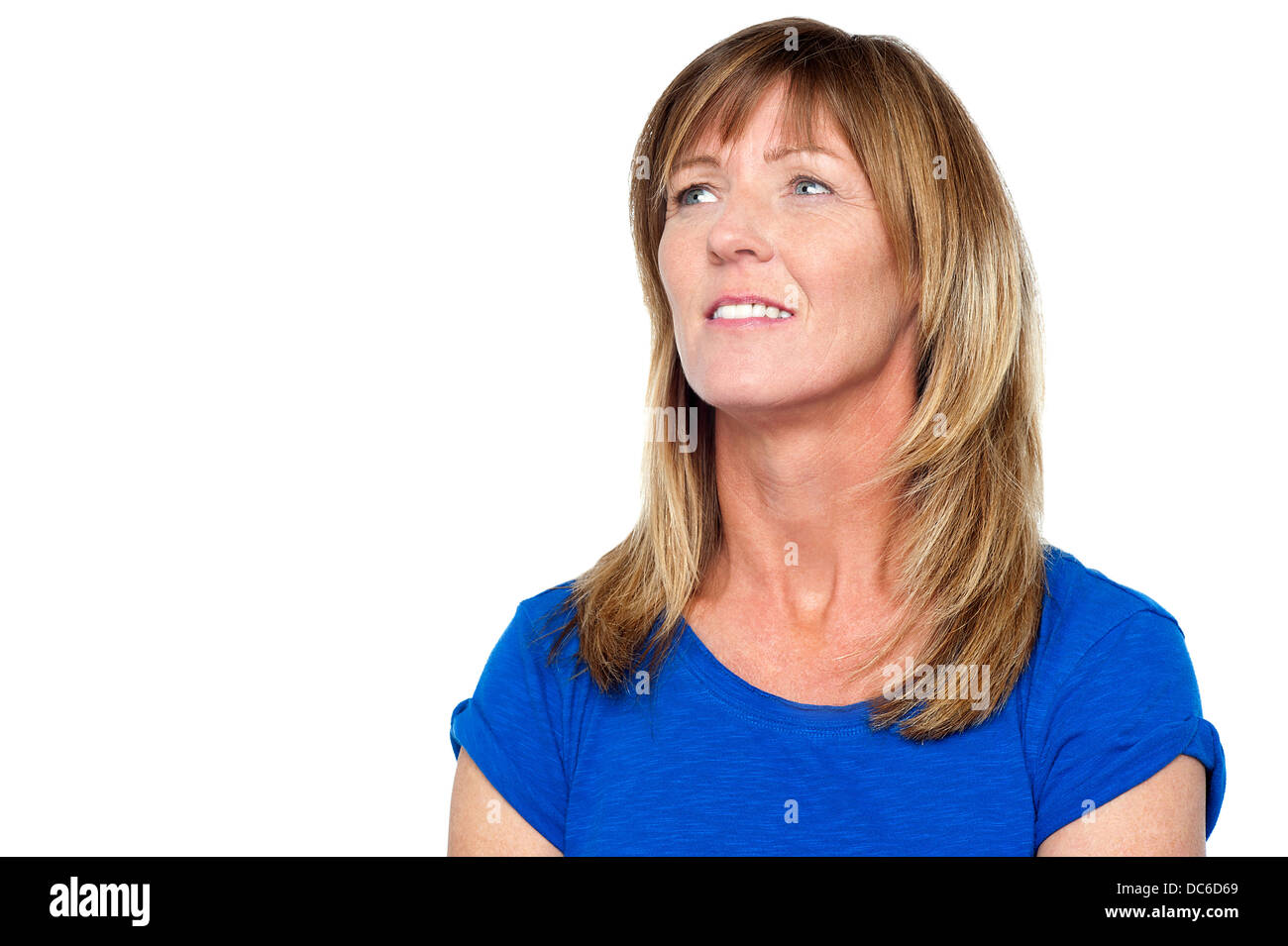 Serious faced woman lady looking up and away Stock Photo - Alamy