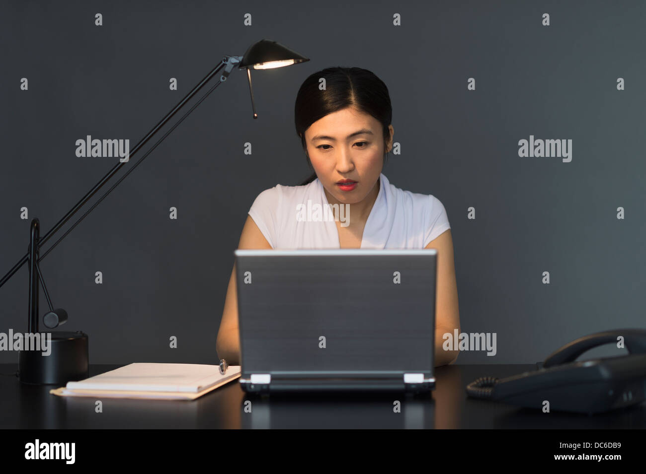 Woman working late on laptop hi-res stock photography and images - Alamy