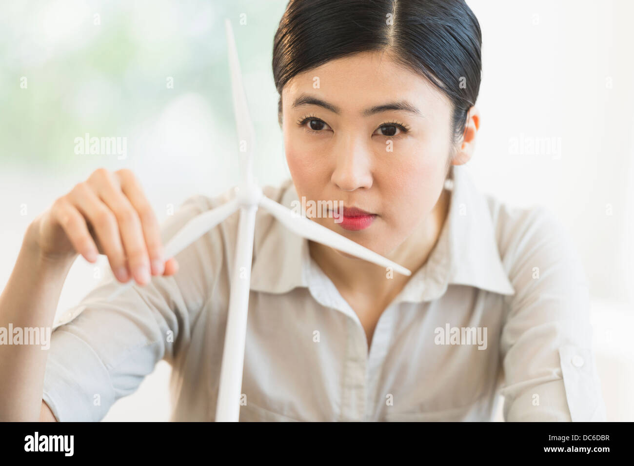 Female engineer working on model of wind turbine Stock Photo - Alamy