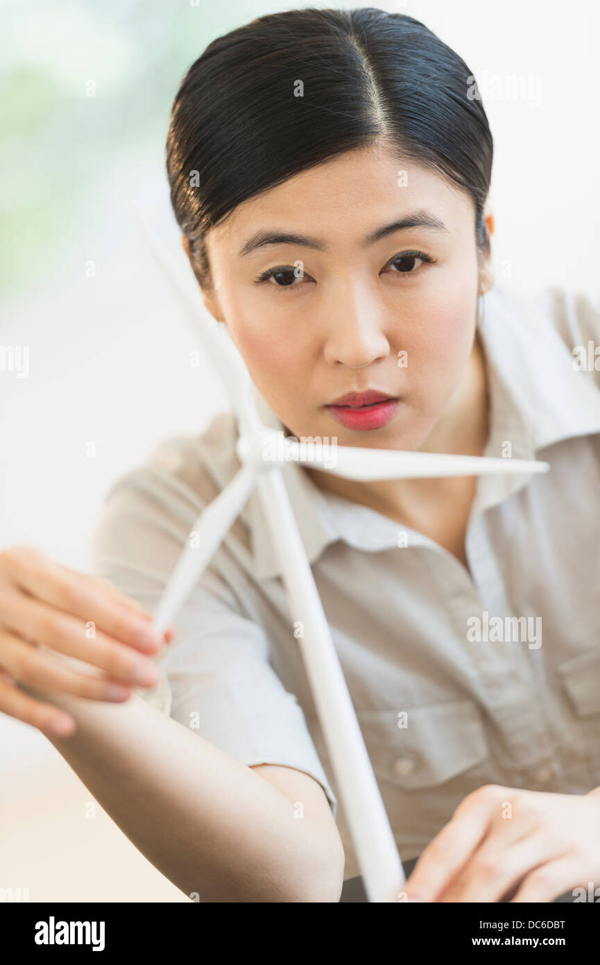 Female engineer working on model of wind turbine Stock Photo - Alamy
