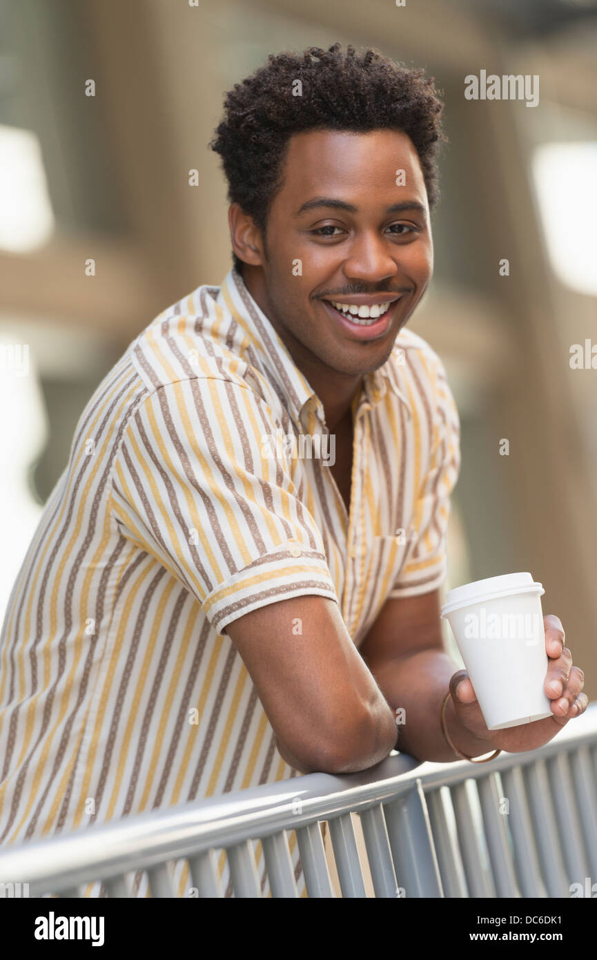 Man drinking coffee outdoors Stock Photo - Alamy