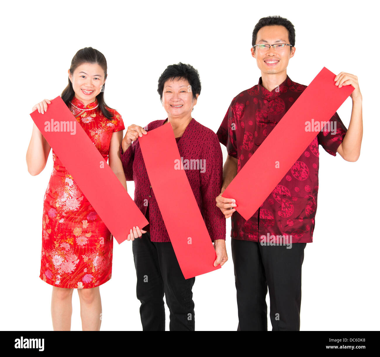 Asian Chinese family holding red spring couplets Stock Photo - Alamy