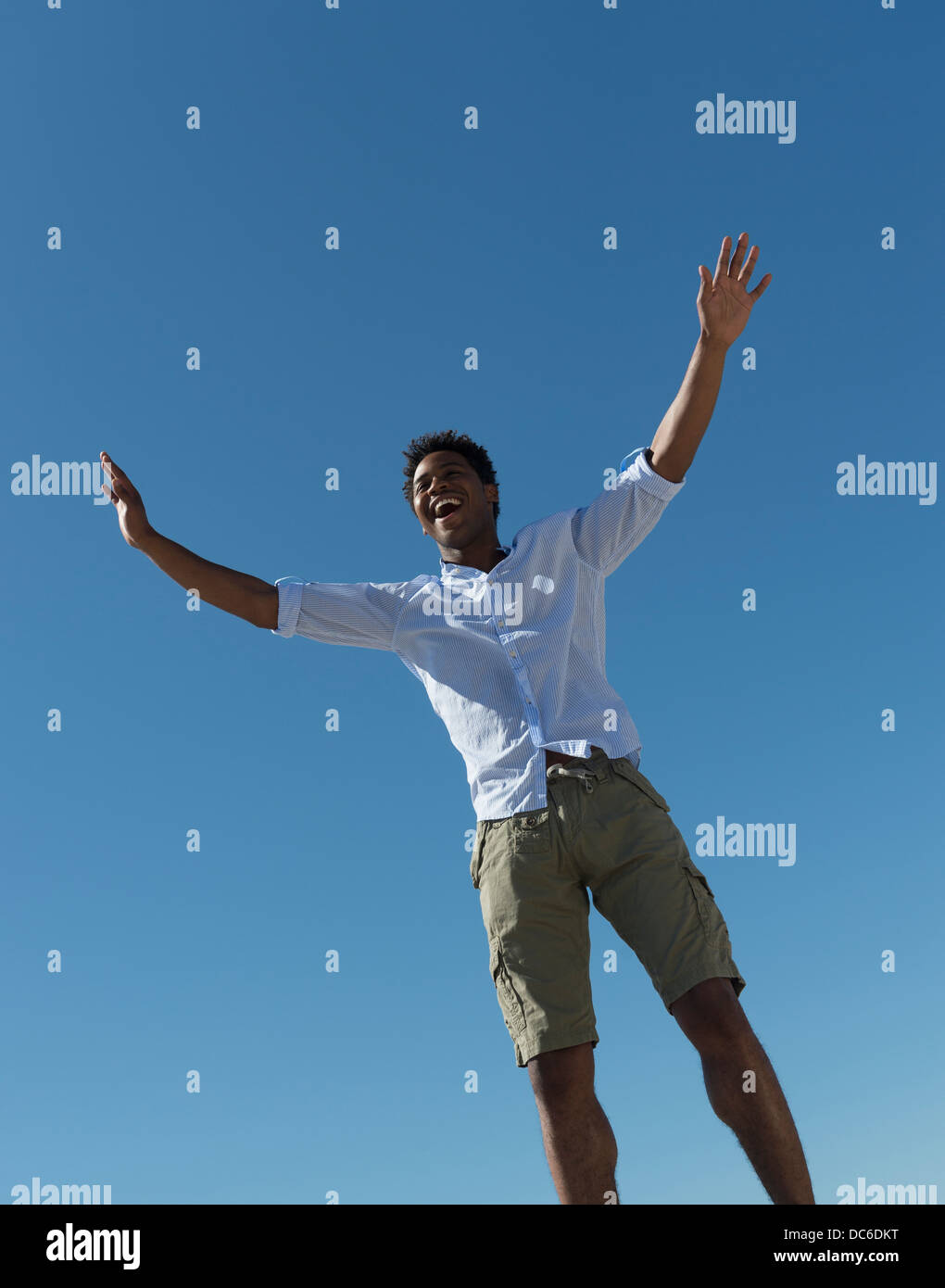 Happy man jump african hi-res stock photography and images - Alamy