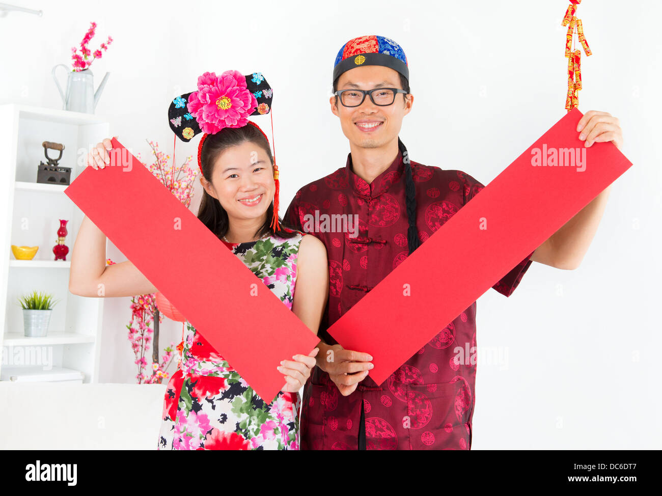 Asian people Showing red spring couplets Stock Photo - Alamy