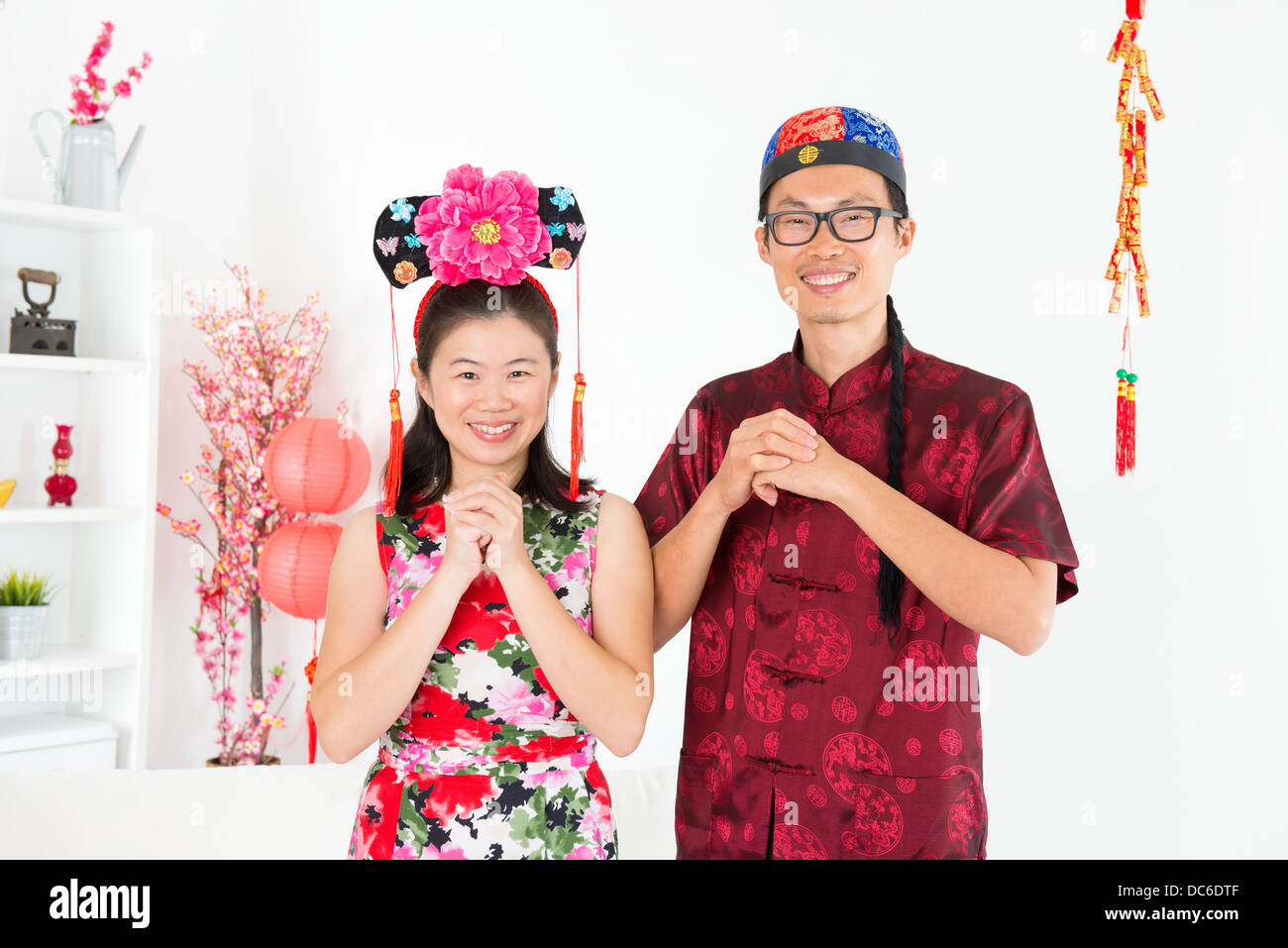 Asian people blessing during Chinese New Day Stock Photo - Alamy
