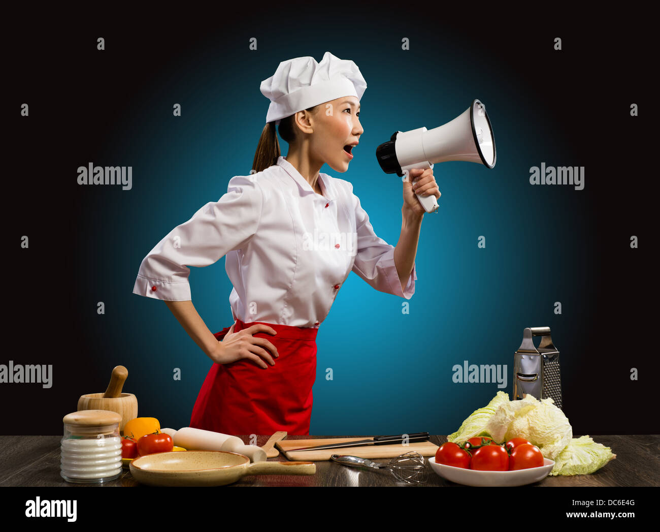 Asian female chef shouting into a megaphone Stock Photo - Alamy