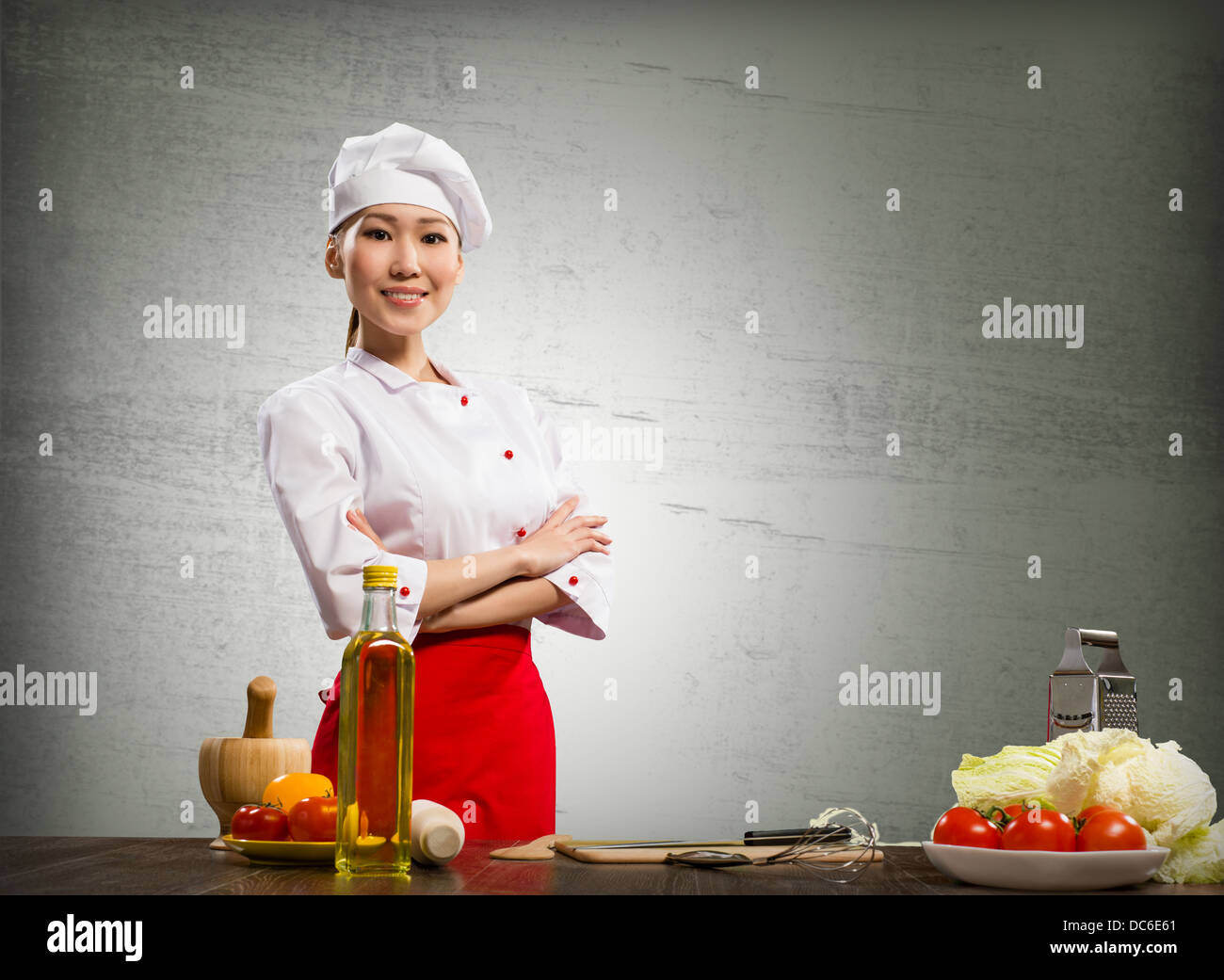 Asian cook woman crossed her arms Stock Photo - Alamy