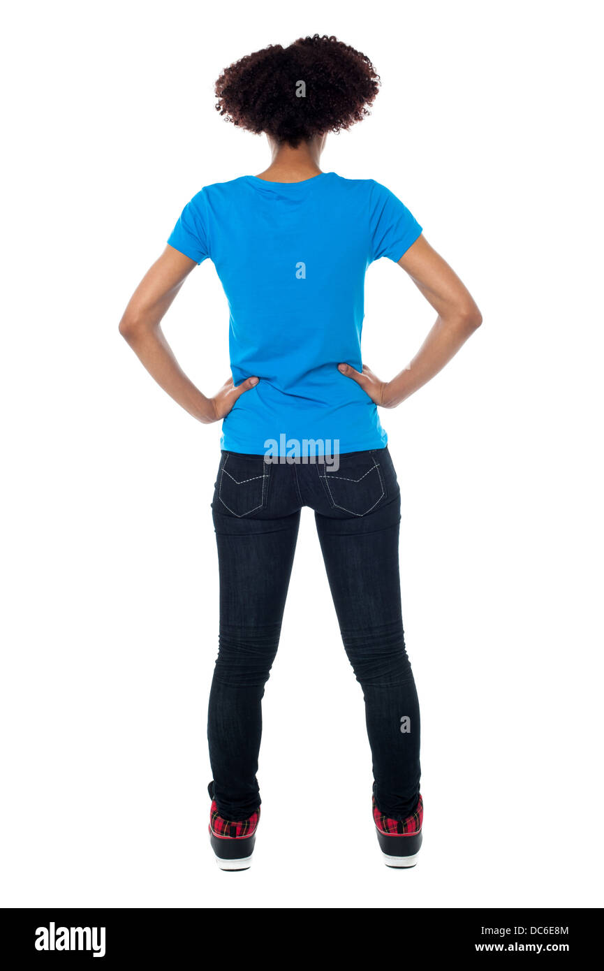 Back pose of young woman facing wall Stock Photo - Alamy