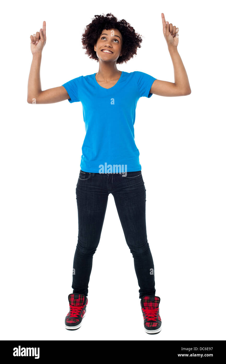 Amused young lady pointing looking hi-res stock photography and images ...