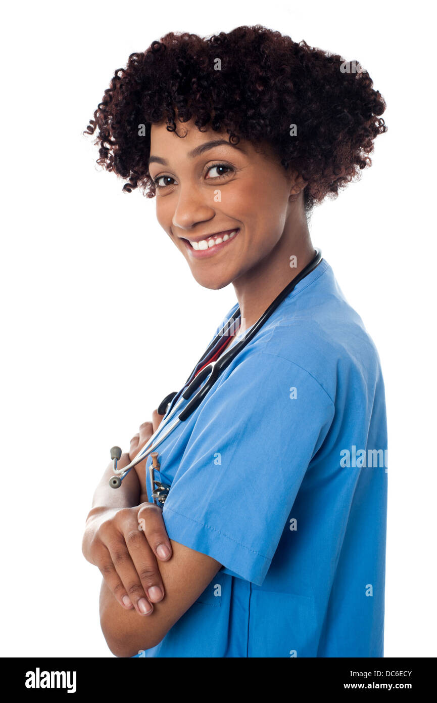 Smiling female physician standing sideways with folded arms Stock Photo ...