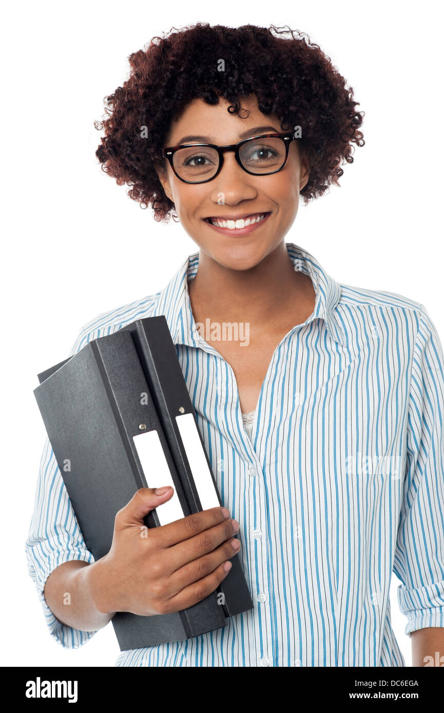 Bespectacled woman in casuals holding files Stock Photo - Alamy