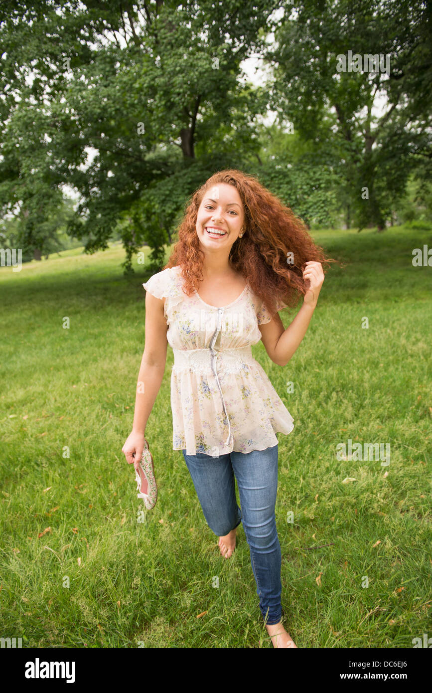 Young woman walking long hair hi-res stock photography and images - Alamy