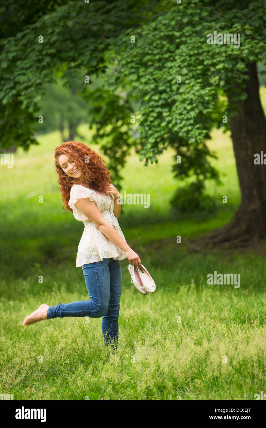 Young curly hair woman walking hi-res stock photography and images - Alamy