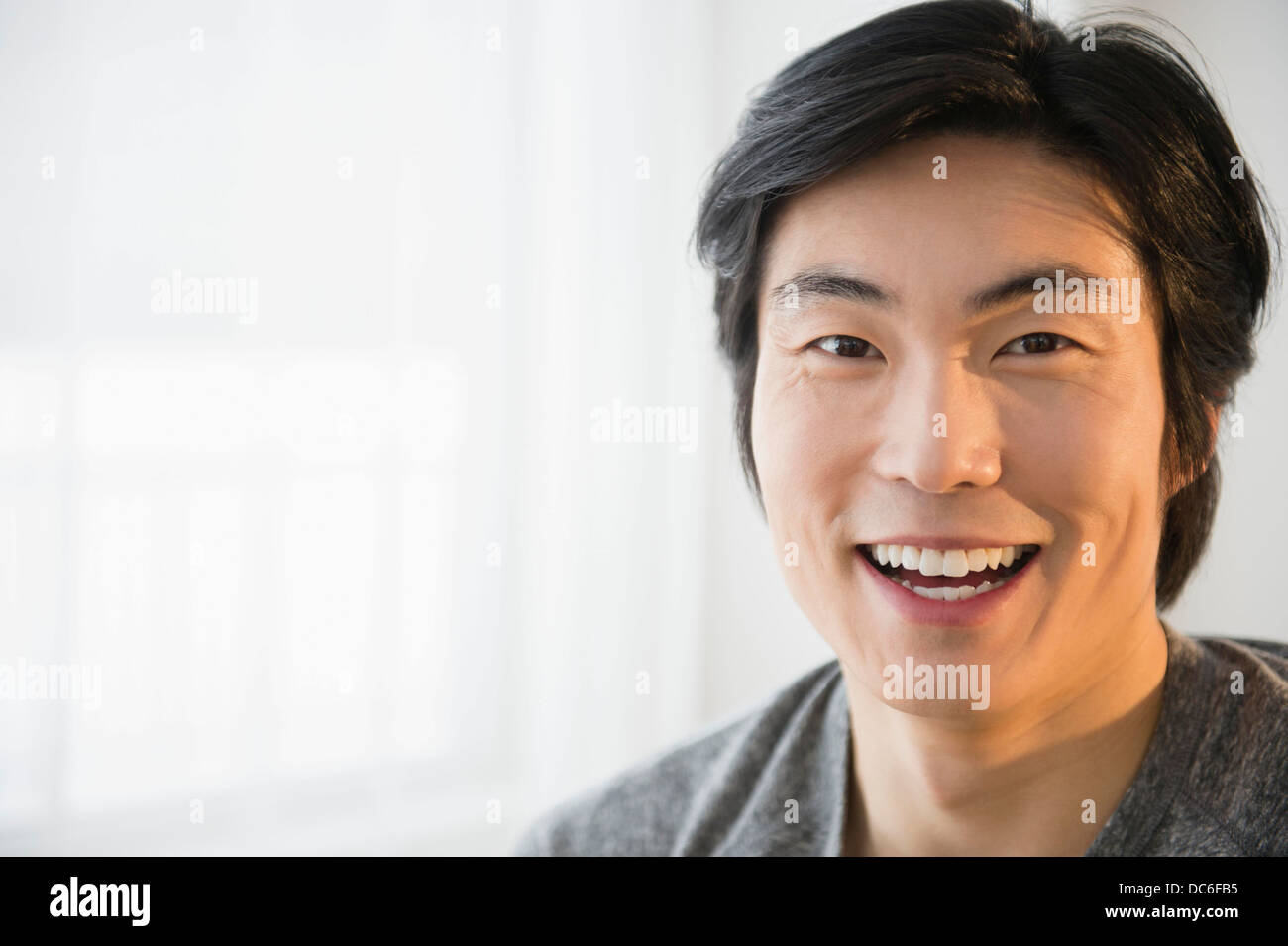 Portrait of young man smiling Stock Photo - Alamy