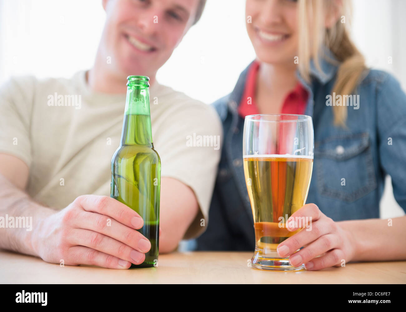 Couple enjoying beer Stock Photo - Alamy